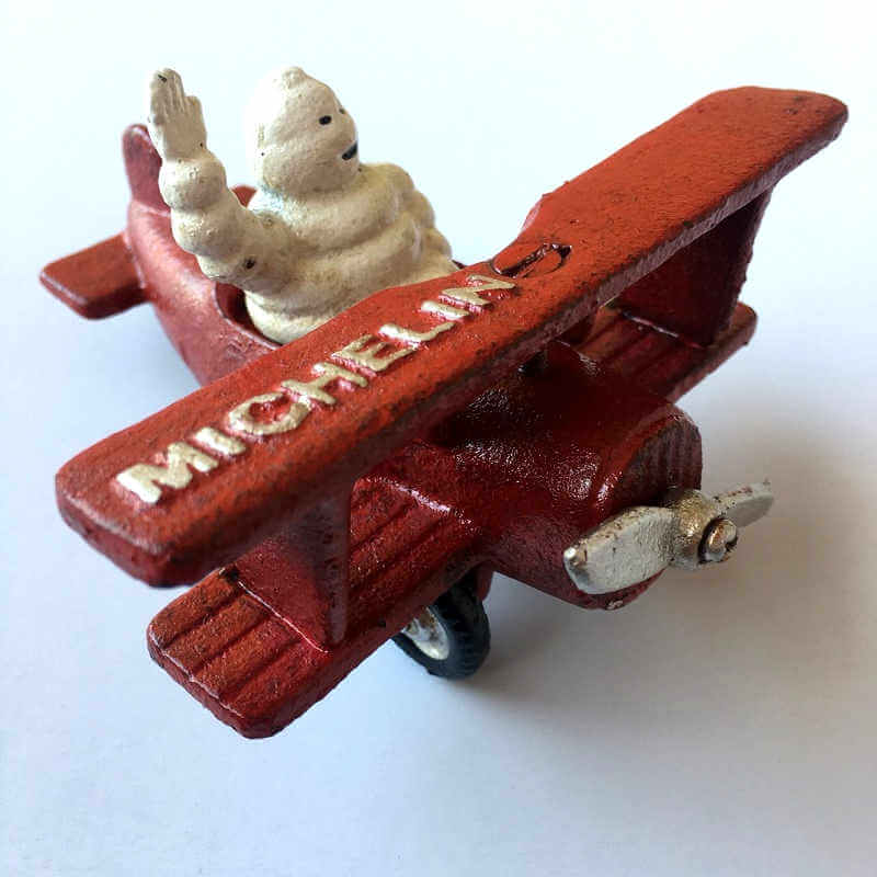 Cast Iron Michelin Man on Plane Gift - Kidscollections